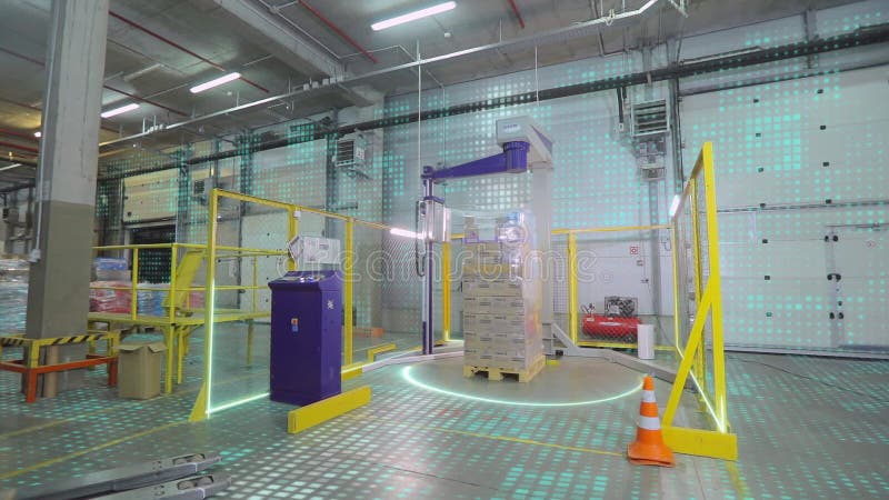 Packing Boxes in Film at the Factory. the Concept of Automatic ...