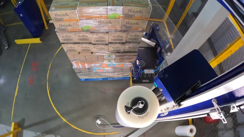 Packing Boxes in Plastic Film. Box Stretch Wrapping Machine. Pallet ...
