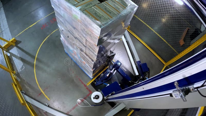 Packing Boxes in Plastic Film Timelapse. Box Stretch Wrapping Machine ...