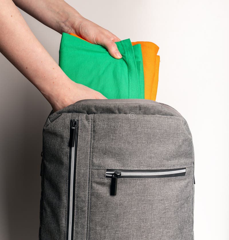 Packing Clothes, Garments into Backpack Stock Photo - Image of open ...