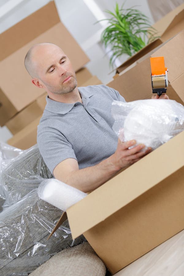 He packing fragile items stock image. Image of labor - 272191347