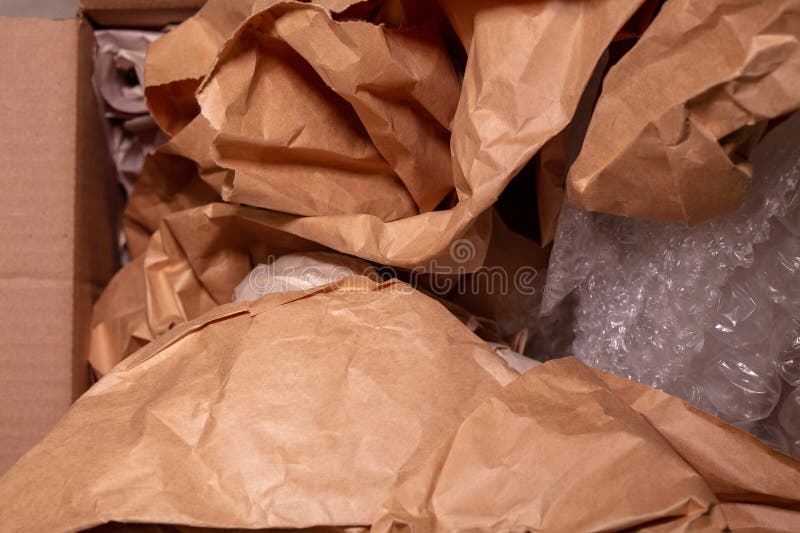 Packing Paper and Plastic Bubble Wrap Stuffed into a Box Moving or ...