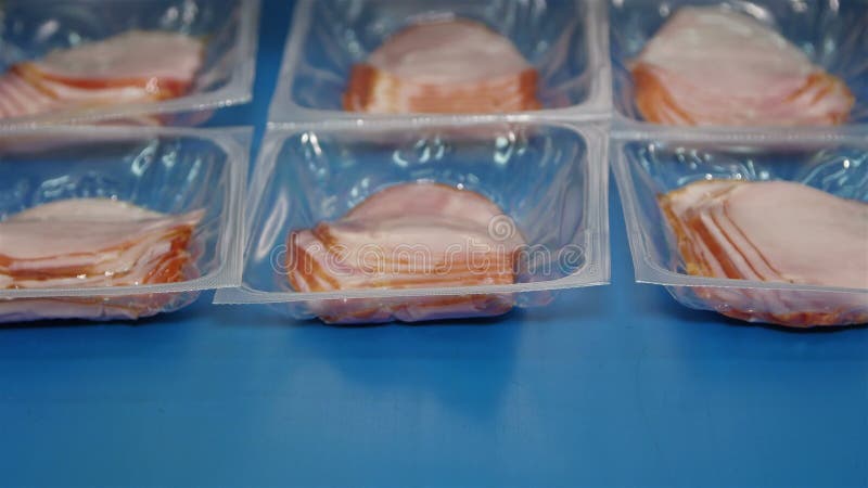 Packing of Pork Ham Slices in Small Boxes in a Meat Processing Factory ...