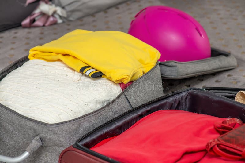 Packing for a Trip. Suitcase with Clothes on the Bed Stock Photo ...