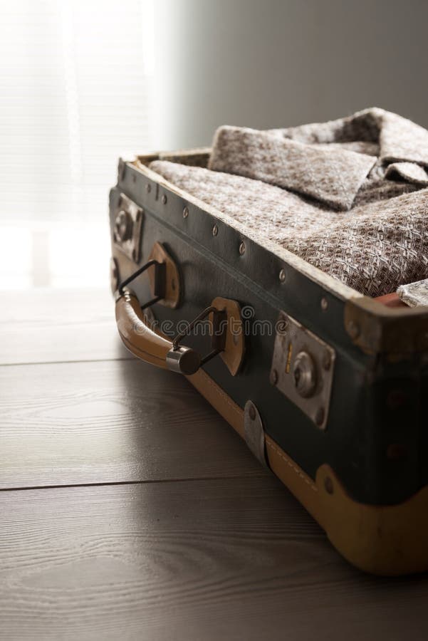 Packing a vintage suitcase stock image. Image of objects - 37265335