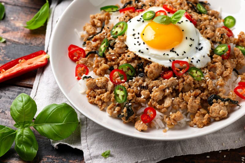 Pad Krapow Gai, Thai Basil Chicken with Rice and Fried Egg Stock Photo ...
