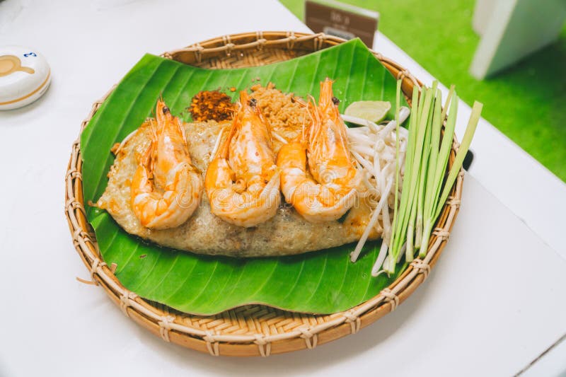 Pad Thai Wrapped in an Egg with Shrimp on Top Stock Photo - Image of ...