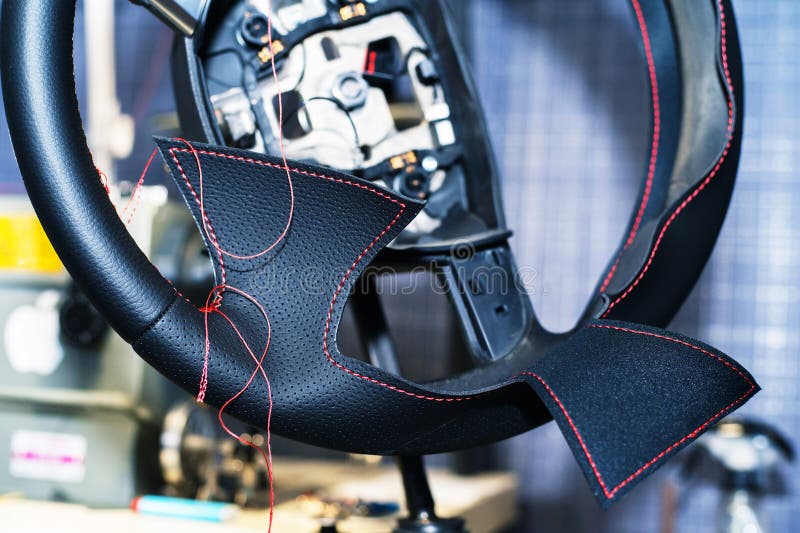 Padding of a Car Steering Wheel with Modern Rubber Materials. Close-up ...