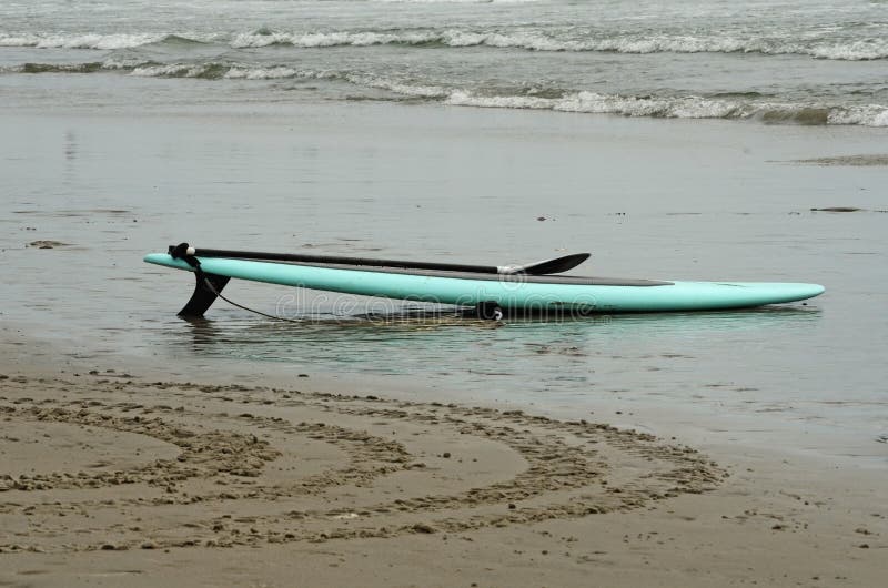 Paddle Board Equipment on the Beach Stock Photo - Image of alone ...