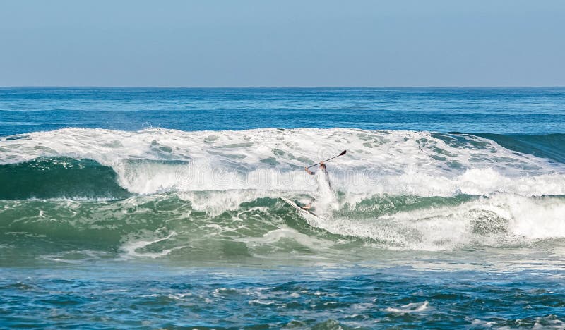 Man Paddle Boarding in Giant Waves Stock Photo - Image of fall, surfer ...