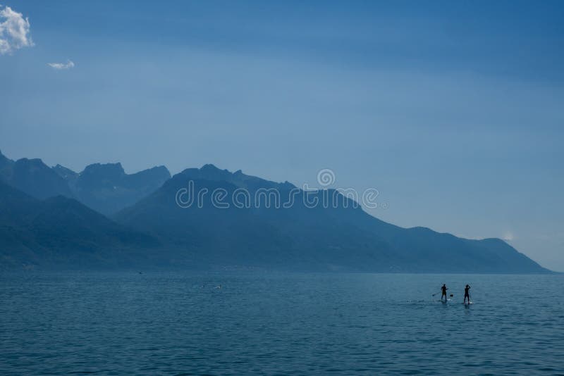 Paddle Borders Make Their Across Lake Geneva in the Midst of Deep ...