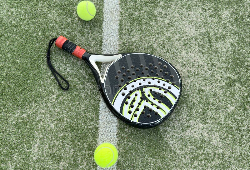 Paddle Tennis Racket, Ball and Net on the Grass Stock Photo - Image of ...