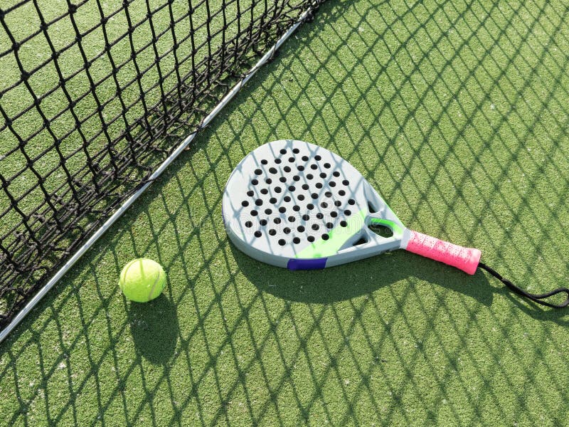 Paddle Tennis Racket, Ball and Net on the Grass Stock Image - Image of ...