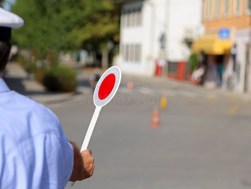 Policeman with the Paddle while Directing Traffic Stock Image - Image ...