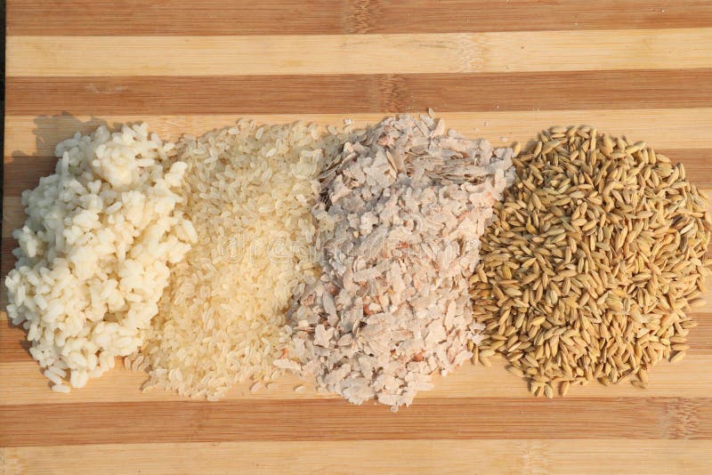 Paddy and Flattened Boiled Dry Rice on Bamboo Table Stock Image - Image ...