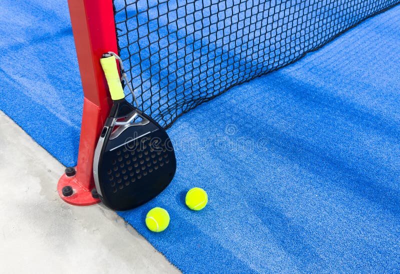 Padel Racket on a Padel Blue Court with a Ball Stock Image - Image of ...