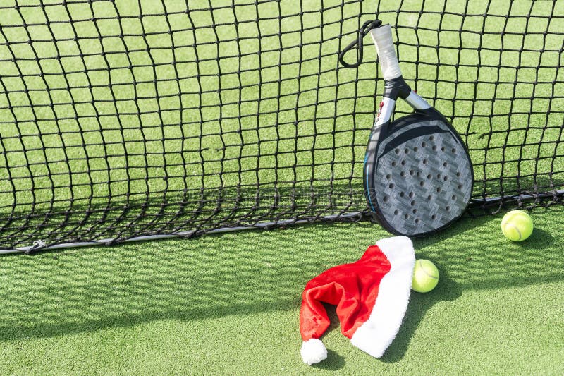 Padel racket and santa hat stock image. Image of collection - 314159049