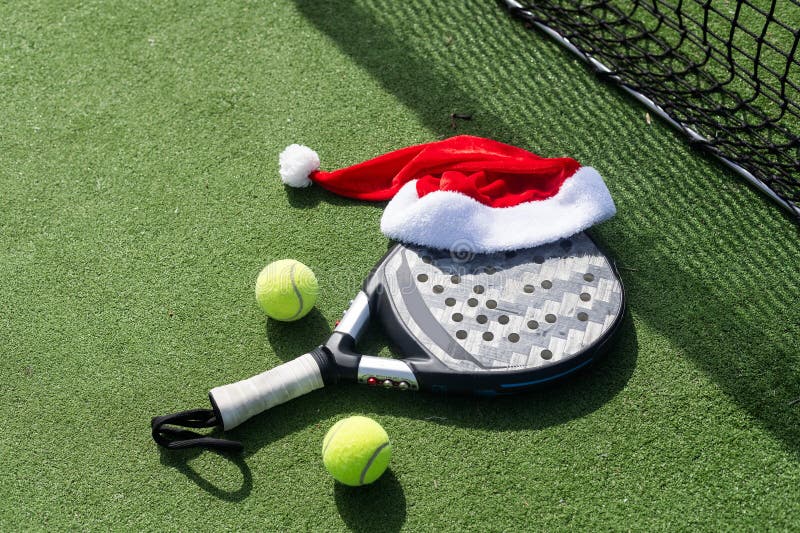 Padel racket and santa hat stock photo. Image of head - 332095826