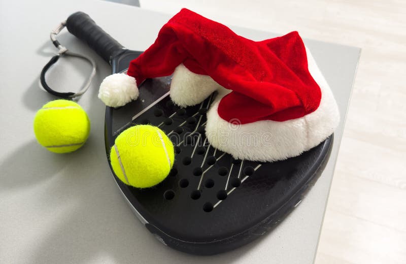 Padel racket and santa hat stock image. Image of open - 350736795