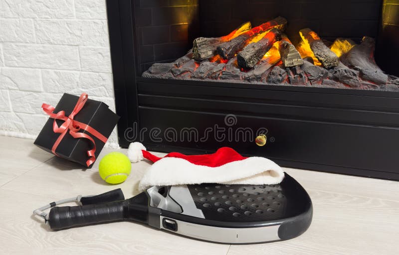 Padel racket and santa hat stock photo. Image of game - 390903104