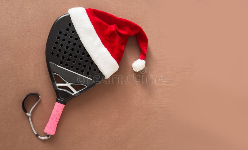 Padel racket and santa hat stock image. Image of snow - 339938527
