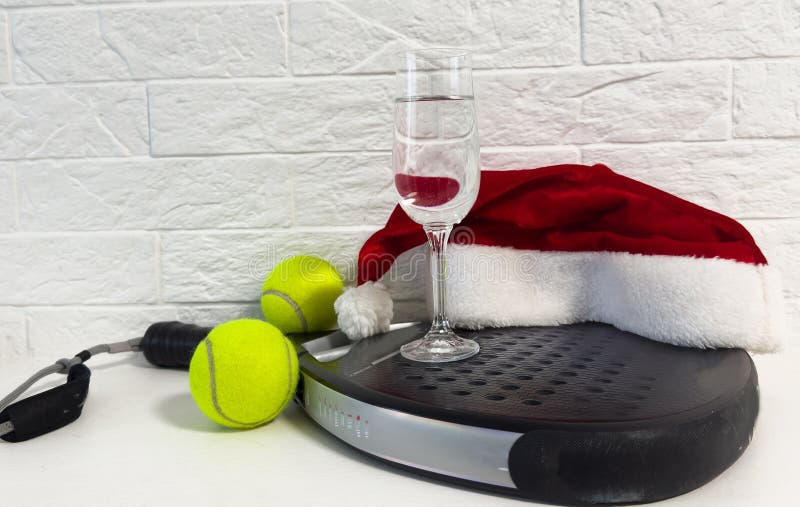 Padel racket and santa hat stock image. Image of portrait - 351618531