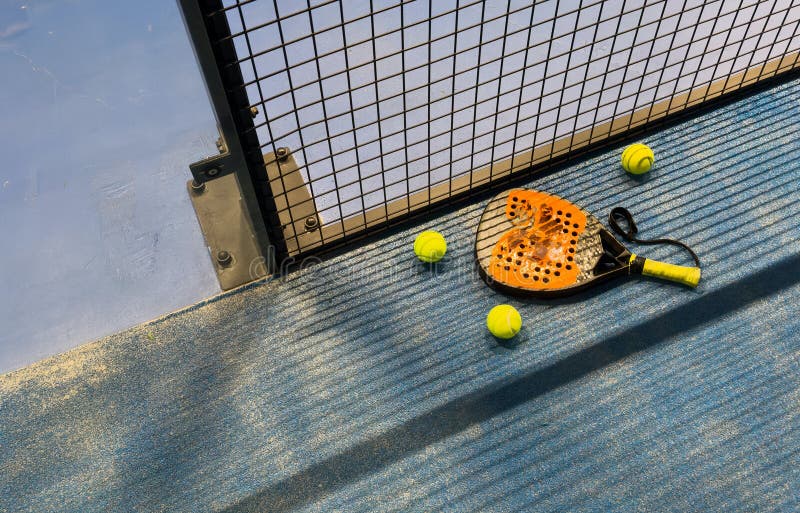 Padel Racket and Yellow Balls Placed on Court Near Net Stock Photo ...