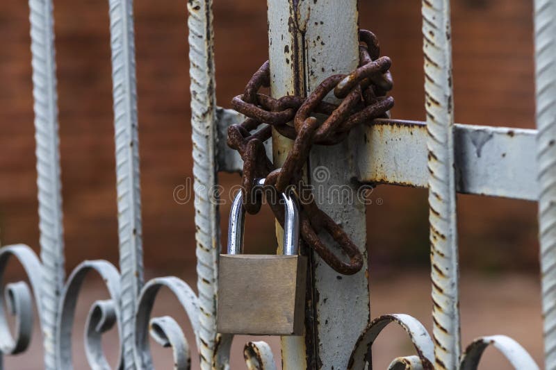 Padlock and Chain on Iron Grid Gate Stock Photo - Image of building ...