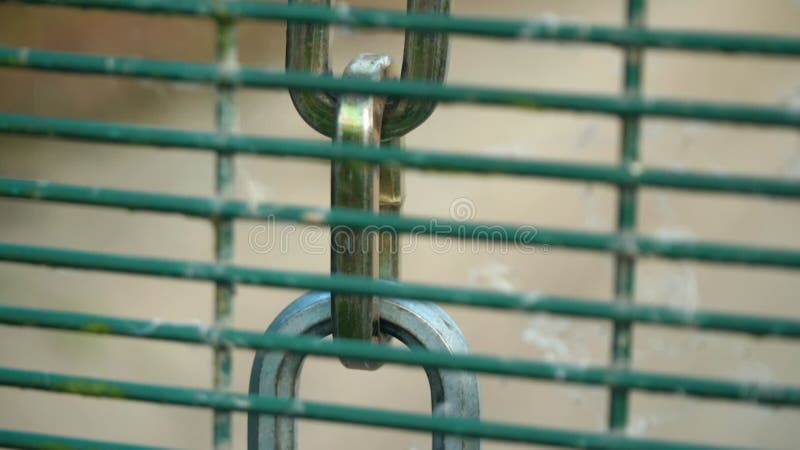 Padlock and Chain Secures Security Gate Stock Video - Video of concept ...