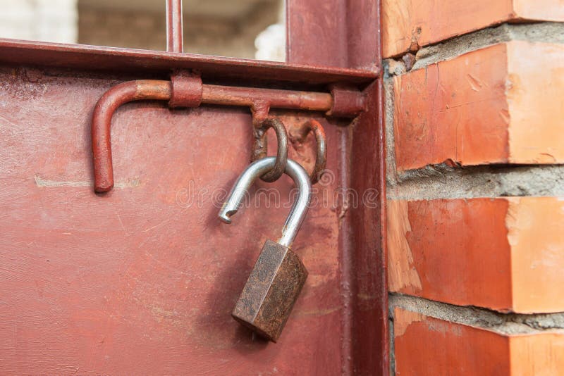 Padlock on the gate stock image. Image of bricks, lock - 83274719