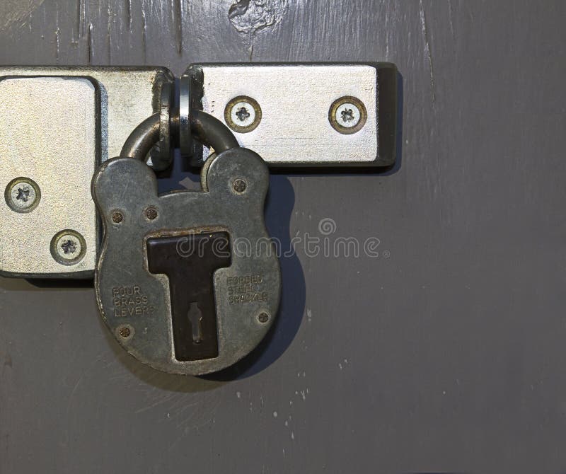 Padlock on grey door stock photo. Image of metal, colour - 23558920