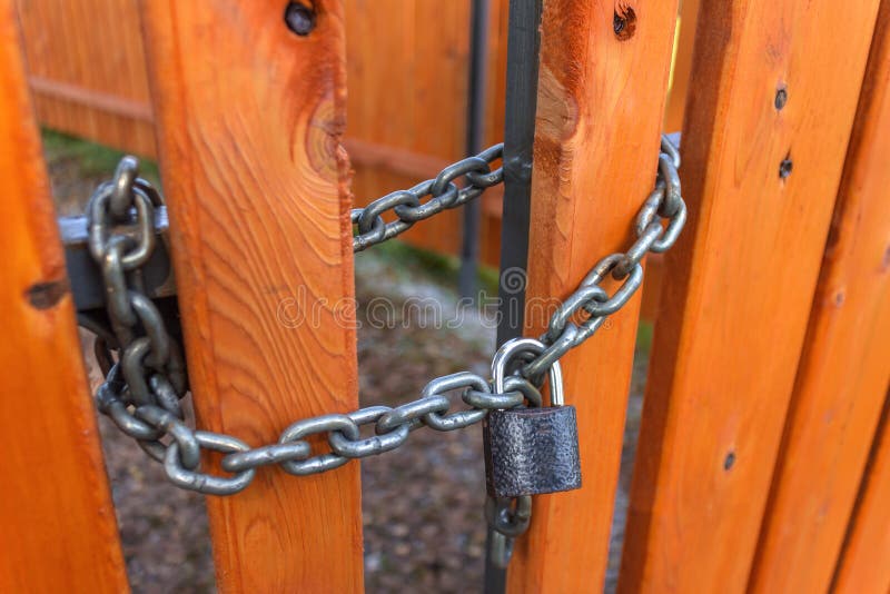A Padlock Hanging on a Tree Branch with Leaves Wet Due To Rain Stock ...