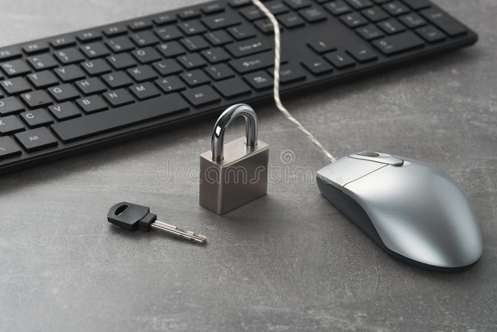 Padlock with Key and Computer Mouse with Keyboard on the Table. Cyber ...