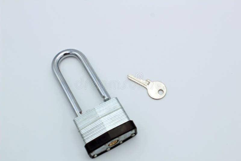 A Steel Padlock and Key Isolated on Plain White Background a Concept of ...
