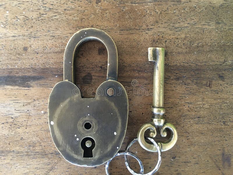 Padlock and Key on the Table Stock Image - Image of table, metal: 286096403