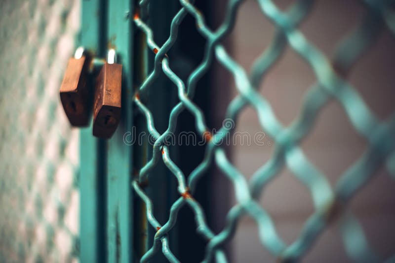 Padlock on metal cage door stock photo. Image of crime - 58251556