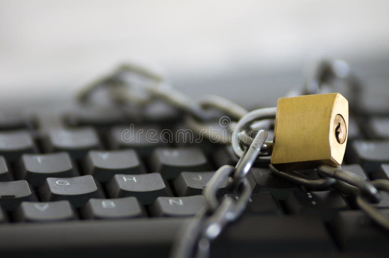 Padlock with Metal Chain Hooked and Locked Across Computer Keyboard ...