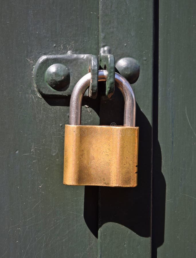 Padlock on the metal door stock image. Image of steel - 81913049