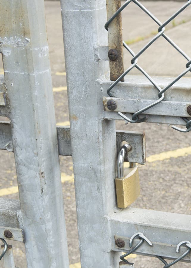 Padlock on a metal gate stock photo. Image of gate, exclusion - 58231484