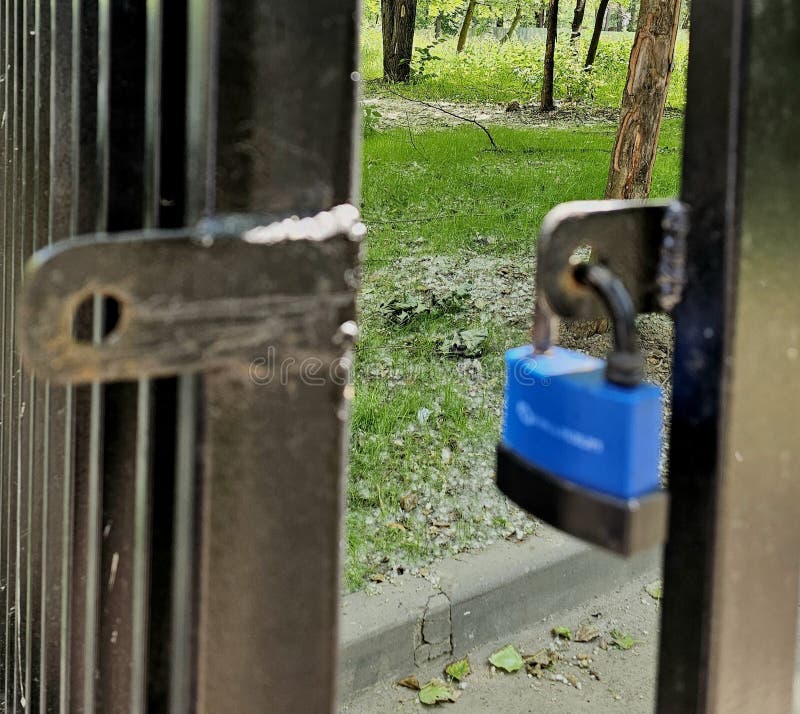 A Padlock, an Open Door, a Lattice Fence, a Gap in the Park. Stock ...