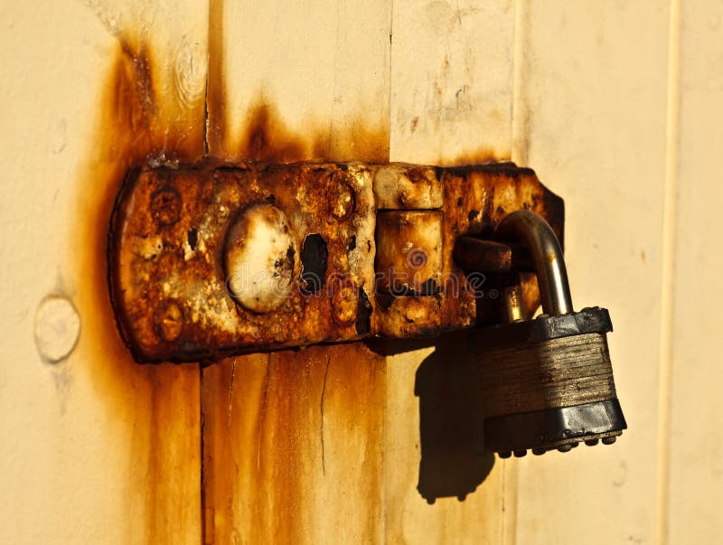 Padlock on rusty door stock image. Image of security - 35131307