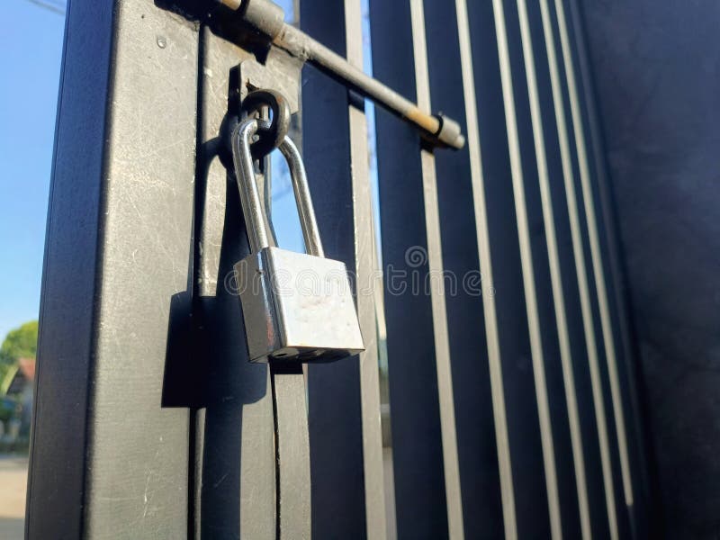 The Padlock is Still Locked on the Black Colored Fence Stock Image ...