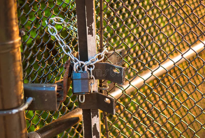 Padlock on wire fence stock photo. Image of chainlink - 27980502