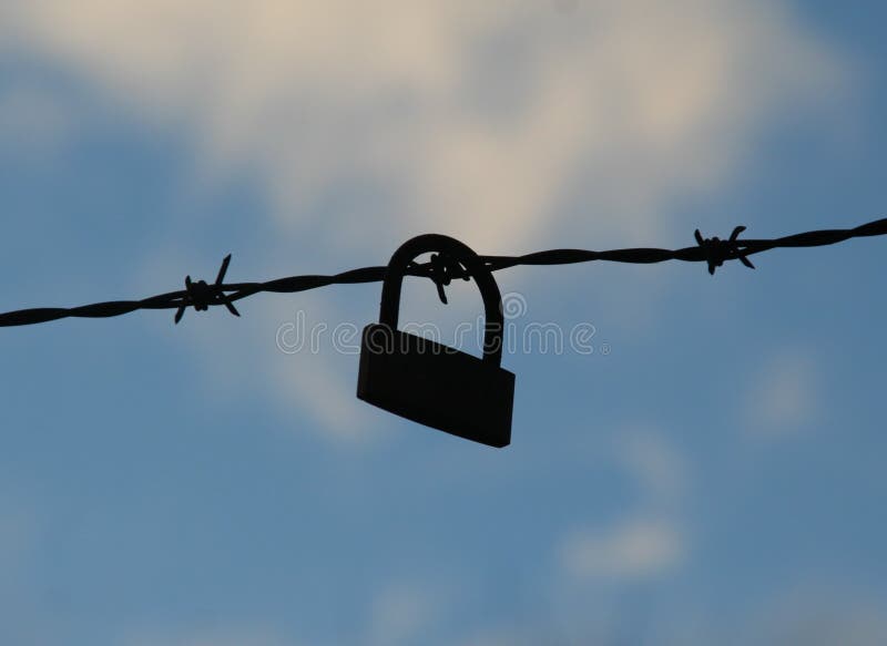 Padlock on a wire stock photo. Image of silhouette, clouds - 250826734