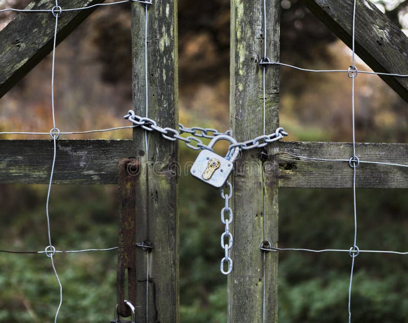 Padlock on wooden gate stock photo. Image of surface - 21832518