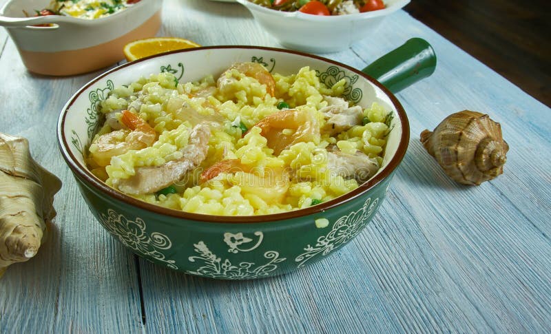 Paella with cod and shrimp stock image. Image of paella - 149616287