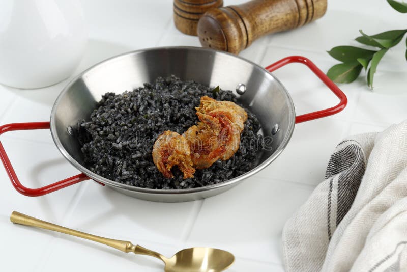 Paella of Rice Black with Squid Ink Stock Photo - Image of herb, dark ...