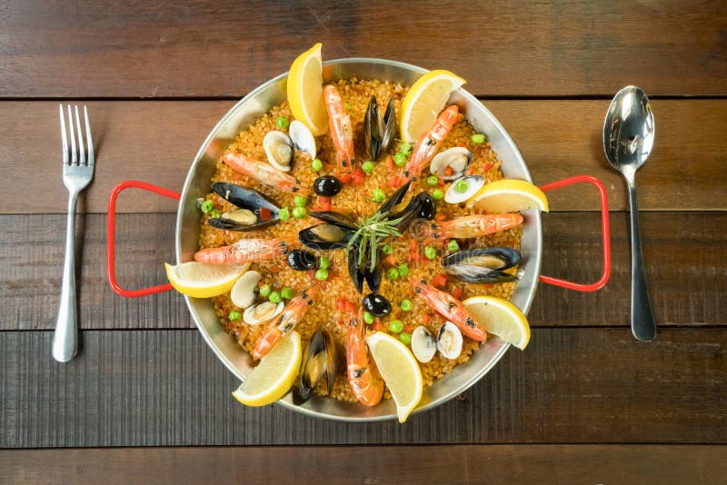 Paella with Seafood Vegetables and Saffron Served in the Traditional ...