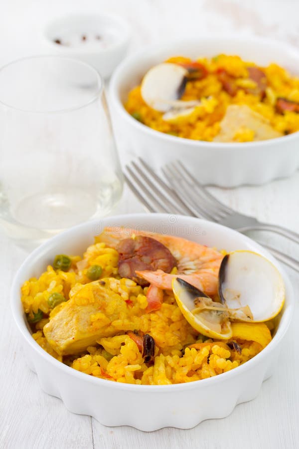 Paella in white dish stock image. Image of cooked, rice - 32752823