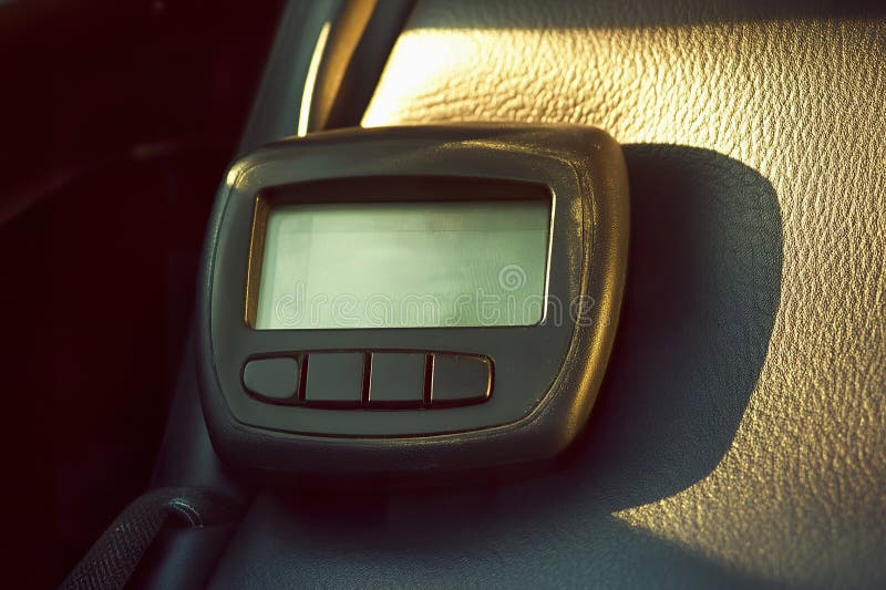 Pager Resting on Passenger Seat in Car during Bright Daylight Drive ...